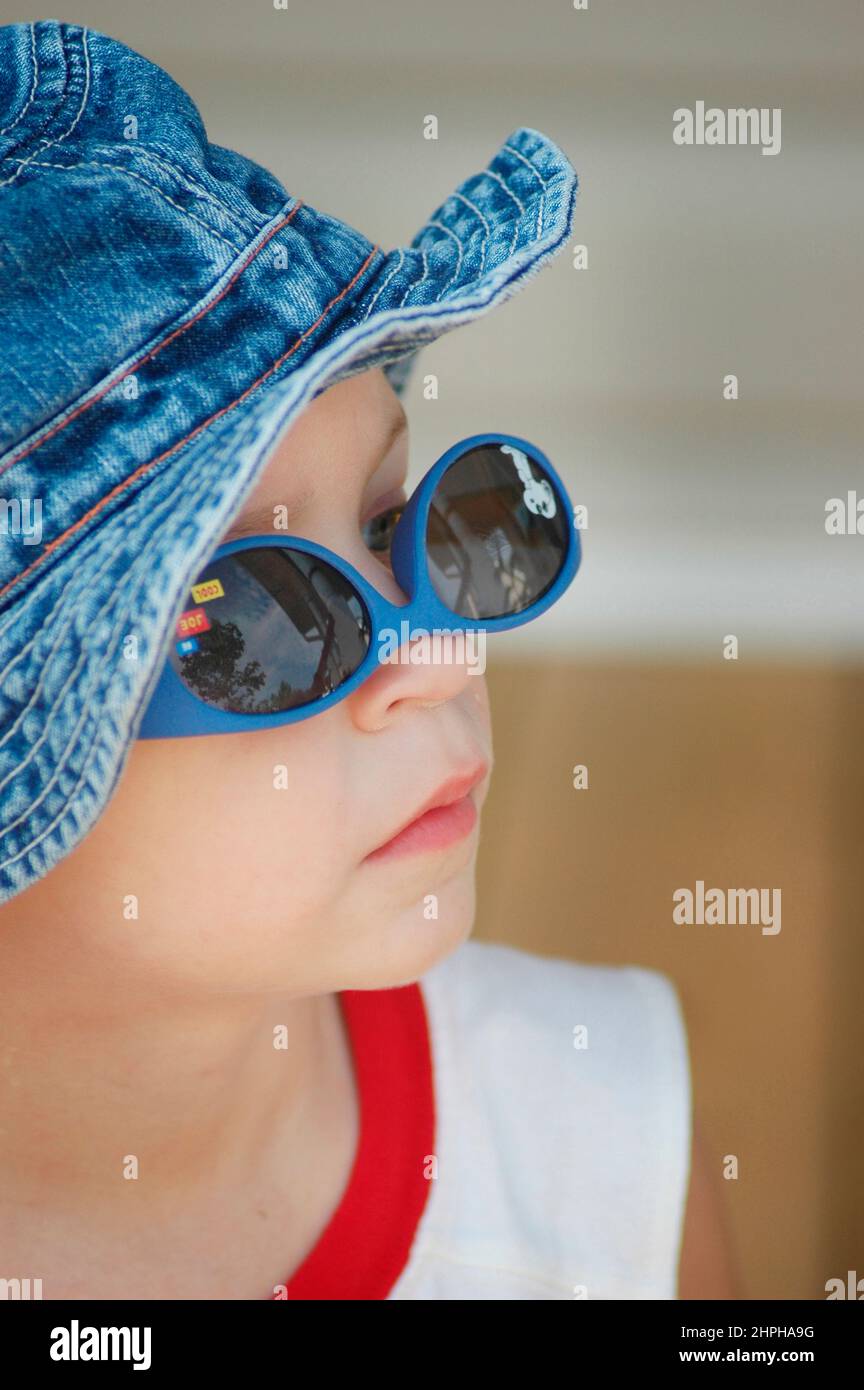 20 month old boy child baby with blue hat and sunglasses and some with ...