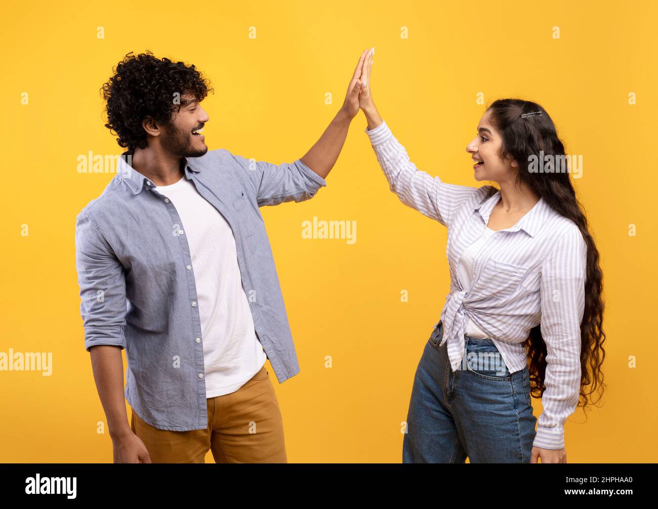 Woman clapping laughing over yellow hi-res stock photography and images ...