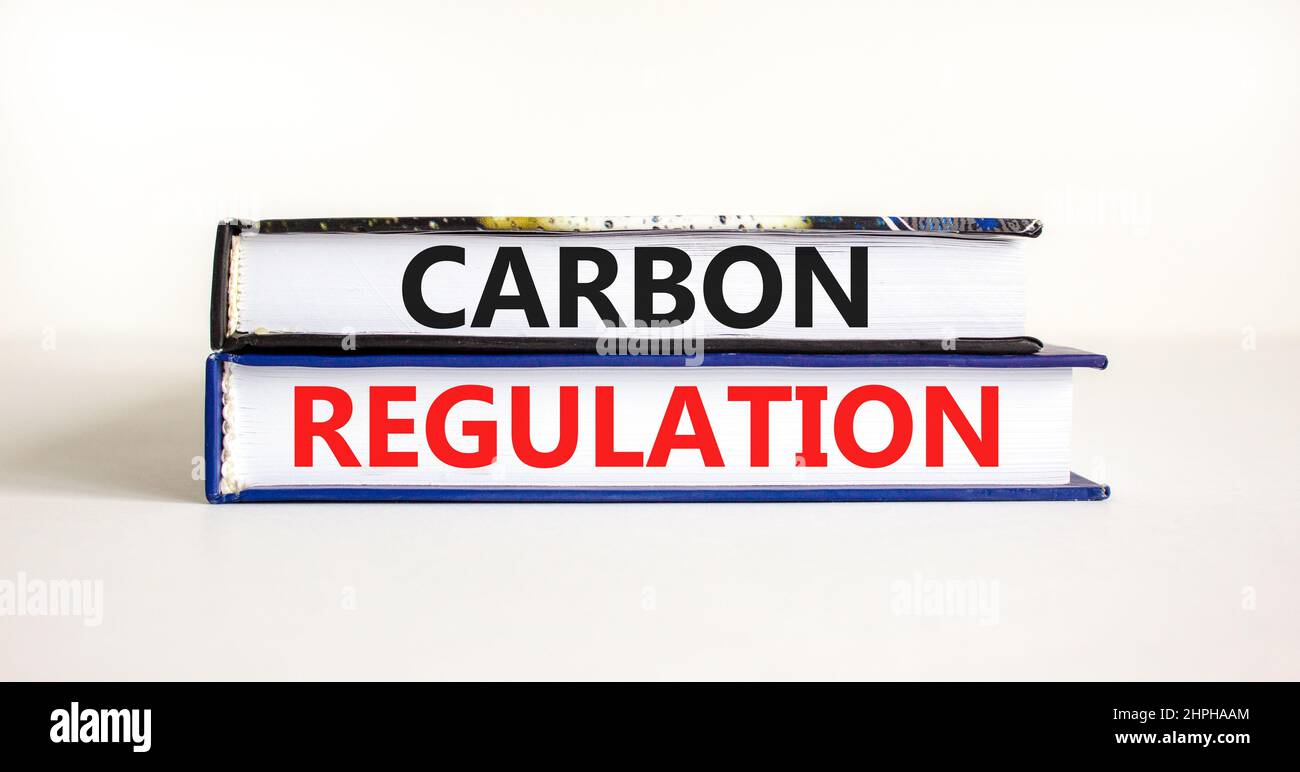 Carbon regulation symbol. Concept words Carbon regulation on books on a ...