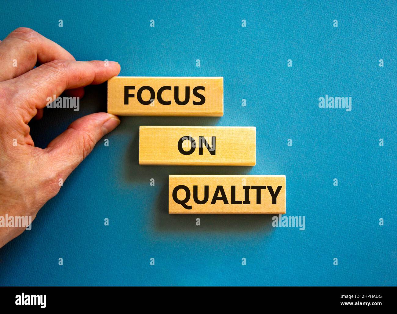Focus on quality symbol. Concept words Focus on quality on blocks on ...
