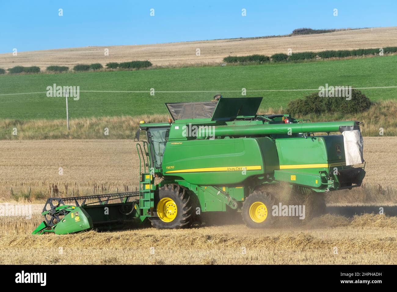 Combining wheat crop with a John Deere T670 combine near Lanark ...
