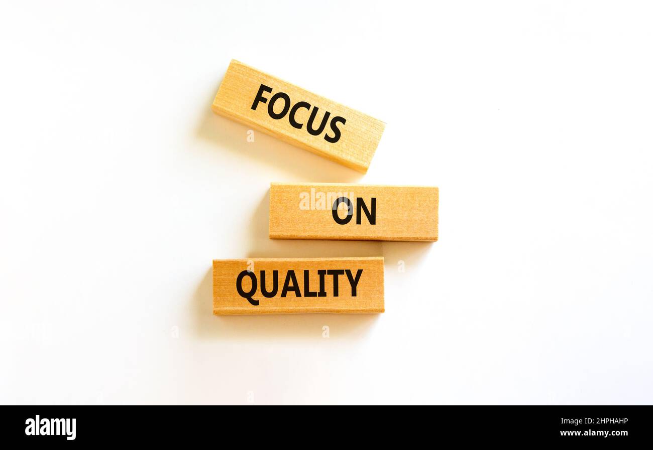Focus on quality symbol. Concept words Focus on quality on blocks on ...