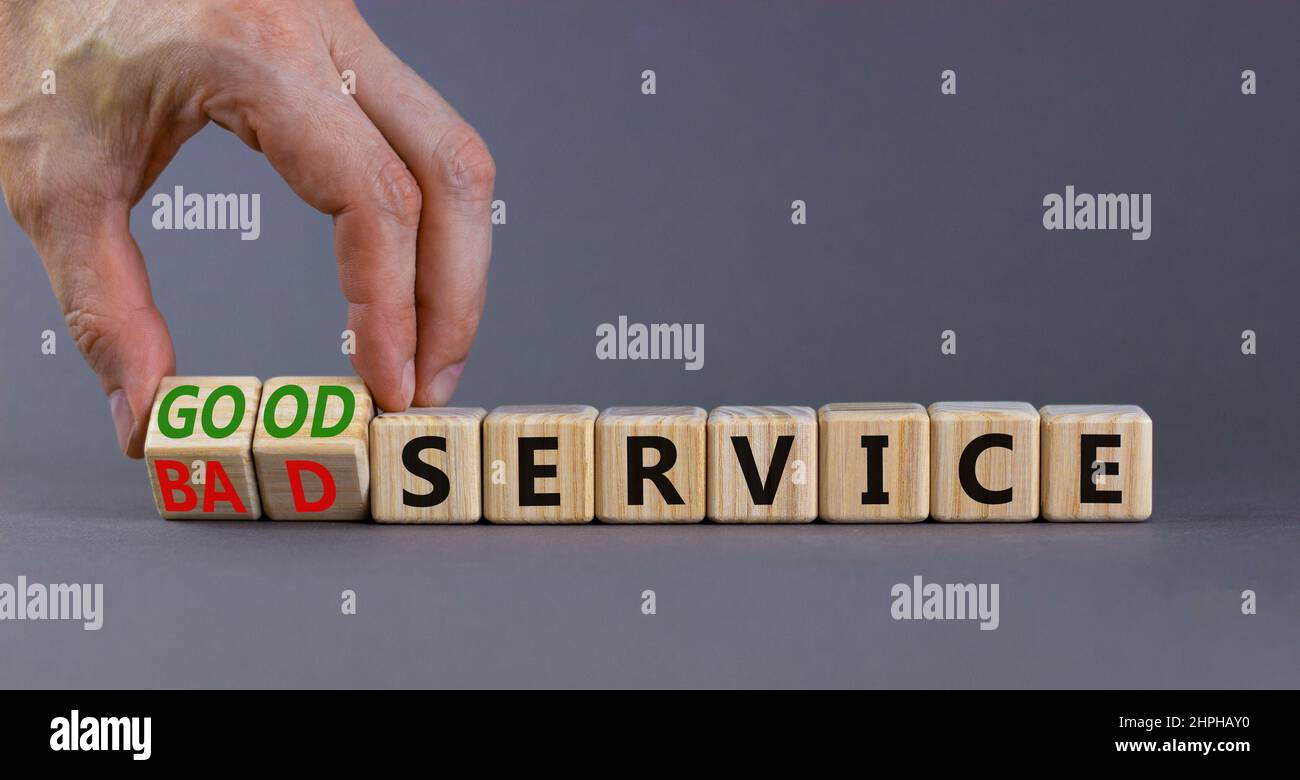 Good or bad service symbol. Businessman turns cubes and changes words ...