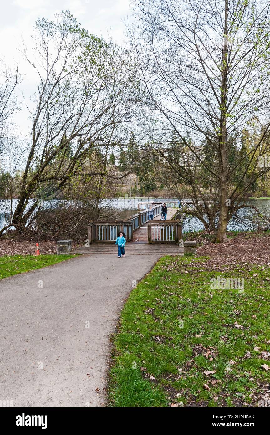 A family at a fishing dock at Lake Boren Park Wetlands in Newcastle ...