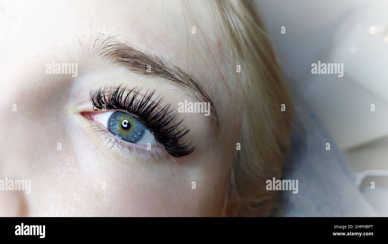 Lash extensions in beauty salon macro eye top view Stock Photo - Alamy