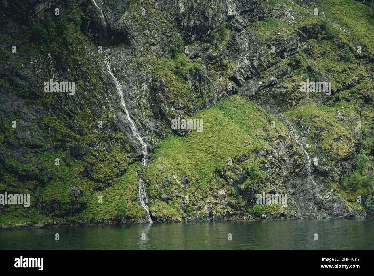 Mesmerizing view of scandinavian green hills and waterfall Stock Photo ...