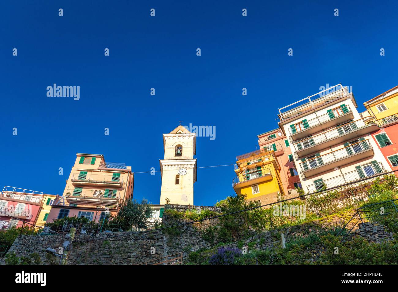 Historic building with bell tower in Manarola, the Cinque Terre towns ...
