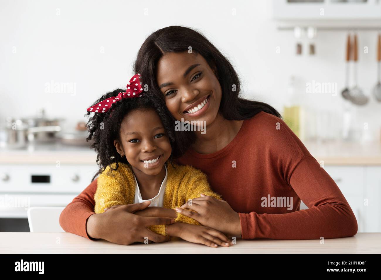 Portrait Of Happy Beautiful Black Mother And Her Little Daughter Posing In Kitchen Interior ...