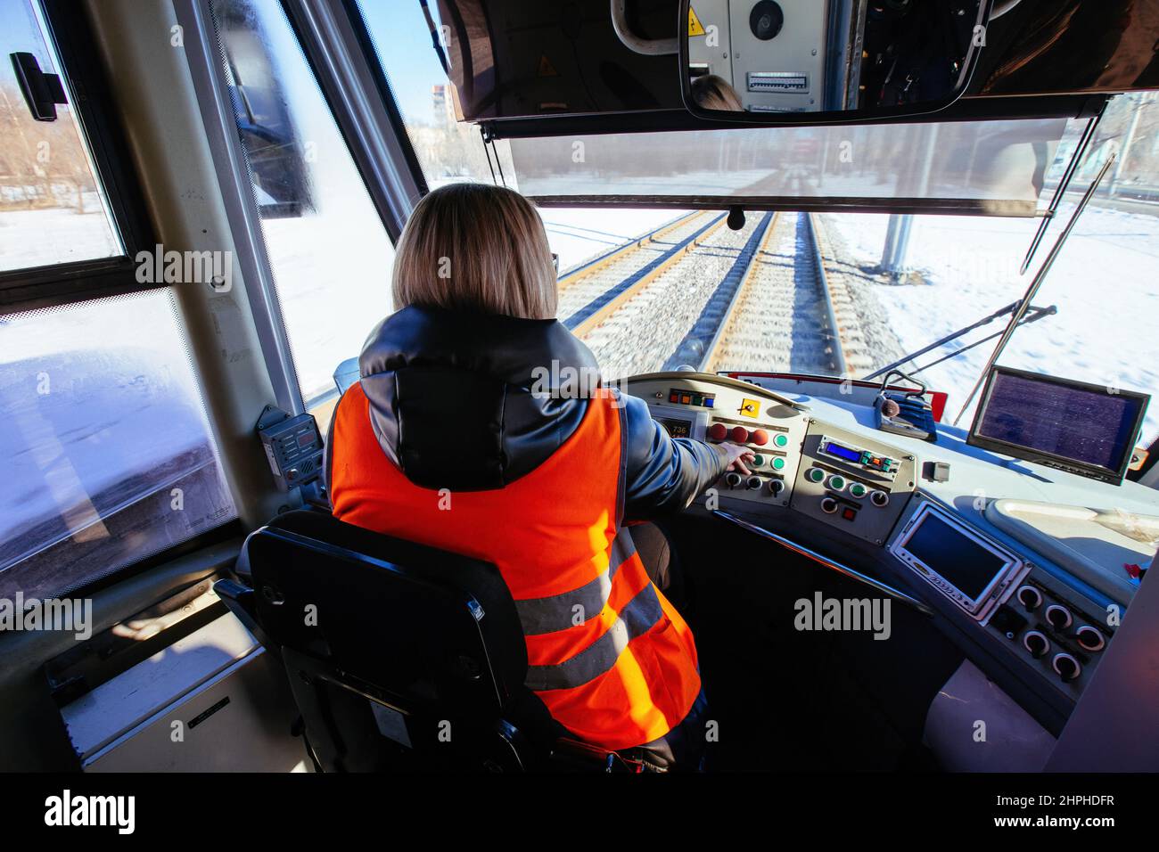 Female tram driver on workplace, view from behind Stock Photo - Alamy