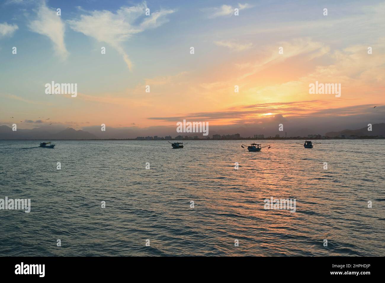Sunset on brazilian beach boats hi-res stock photography and images - Alamy