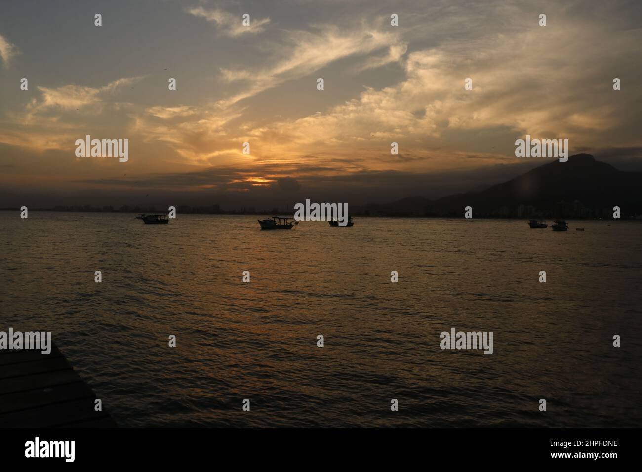 Sunset on brazilian beach boats hi-res stock photography and images - Alamy