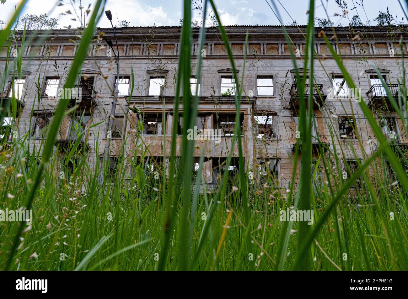 View of the grass building. View from bottom to top. Abandoned building ...