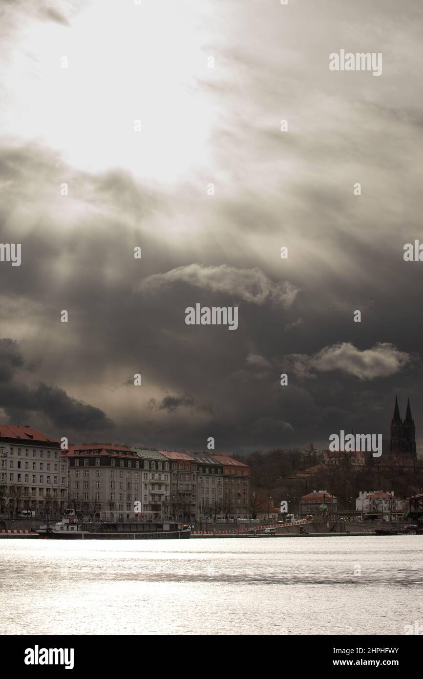 The sky is very dark, the sun's rays break through one last time, a ...