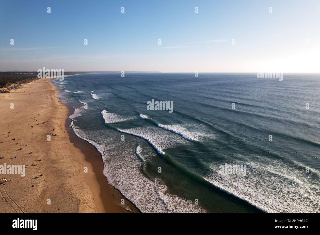 Beautiful view of the blue sea and the sandy shore. Costa da Caparica ...