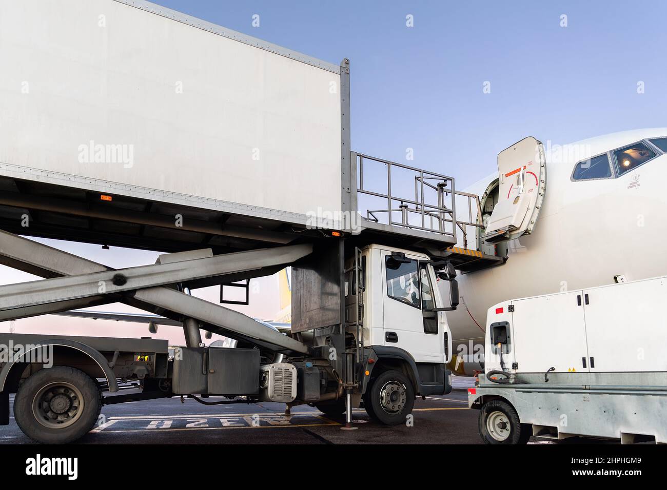 Close-up detail view of highloader cargo catering service truck loading ...