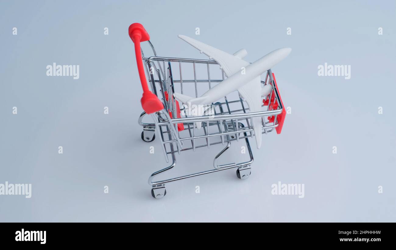 White plane in a shopping trolley Stock Photo - Alamy