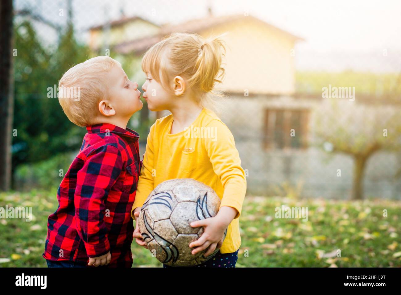 Girl kissing a boy hi-res stock photography and images - Alamy