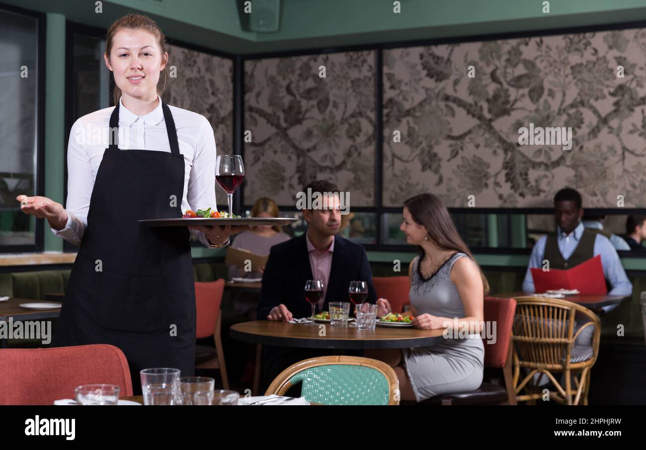 Hospitable smiling waitress tray hi-res stock photography and images ...