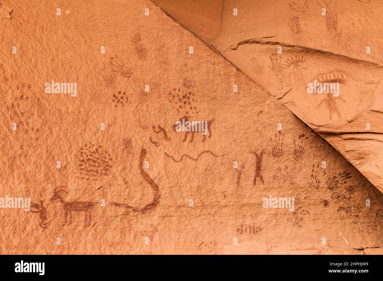 An ancient painted Native American rock art or pictograph panel with ...