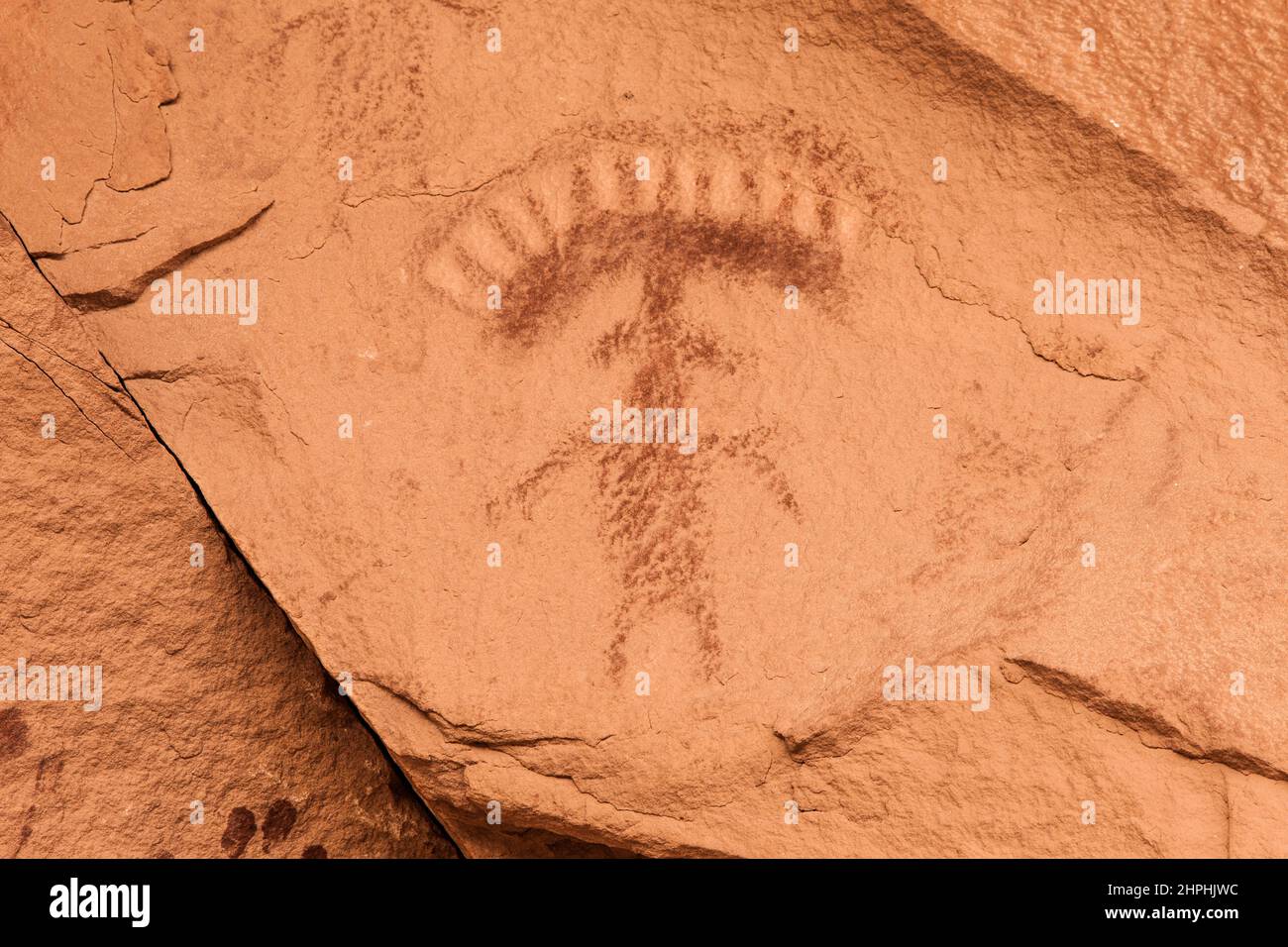 An ancient painted Native American rock art or pictograph panel with an ...