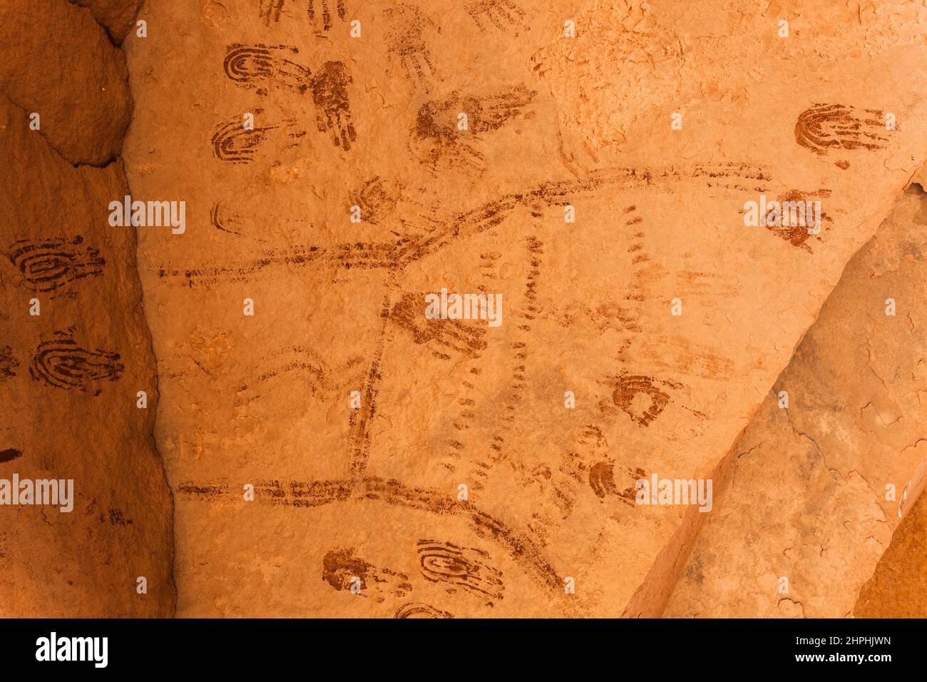 An ancient painted Native American rock art or pictograph panel with ...