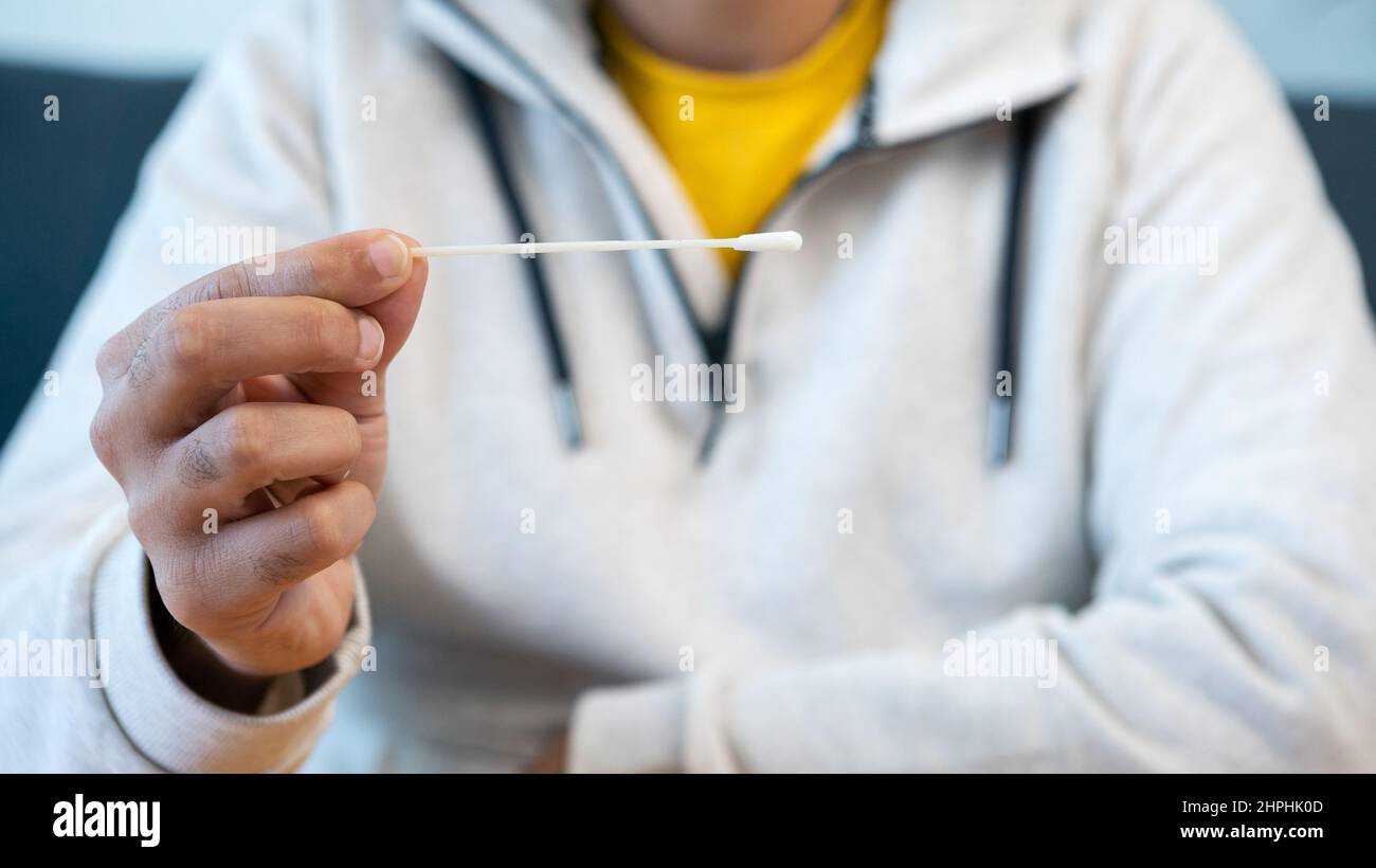 Close-up of relaxed man taking a self swabbing home tests for Covid19 ...