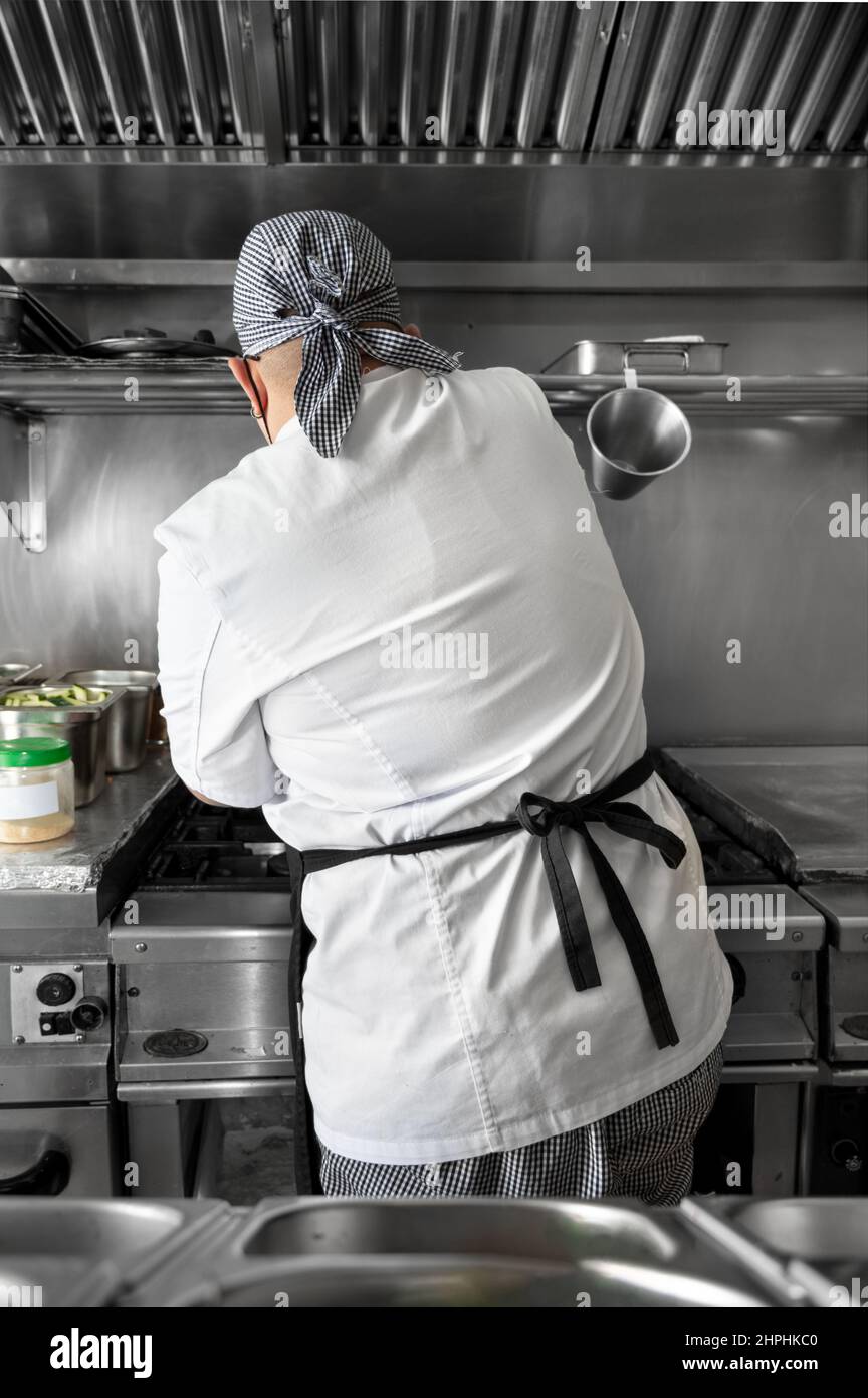 Back view woman cooking in kitchen hi-res stock photography and images ...