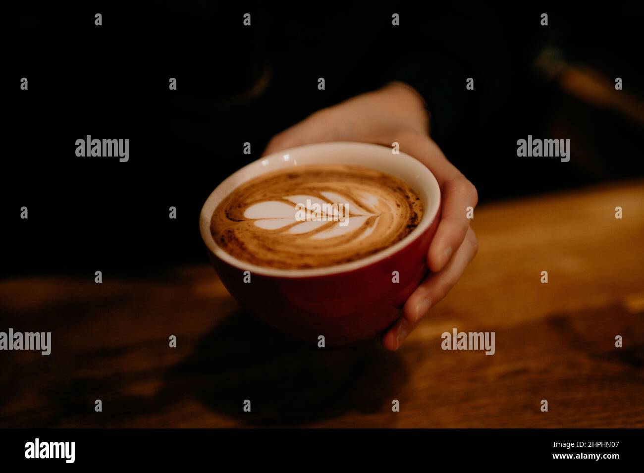 Hand holding red mug hi-res stock photography and images - Alamy
