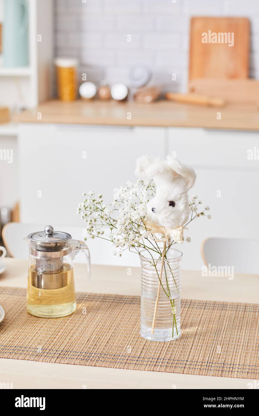 Vertical background of cozy kitchen interior with white table and cute ...