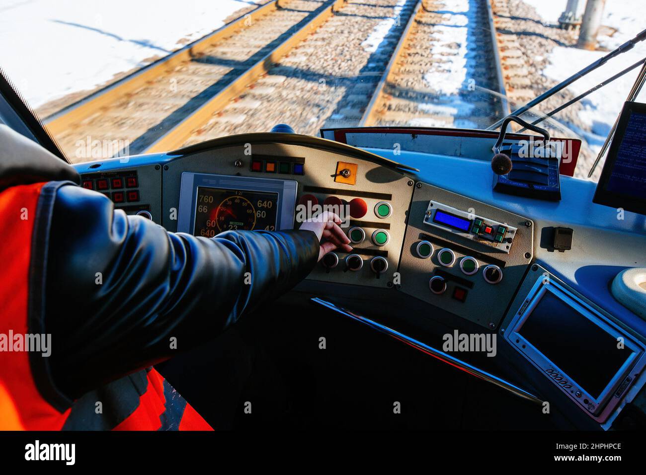 Hand of tram driver on the dashboard Stock Photo - Alamy