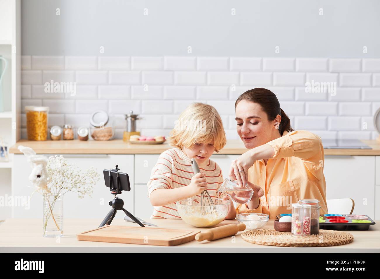 Mom cooking for boy hi-res stock photography and images - Alamy