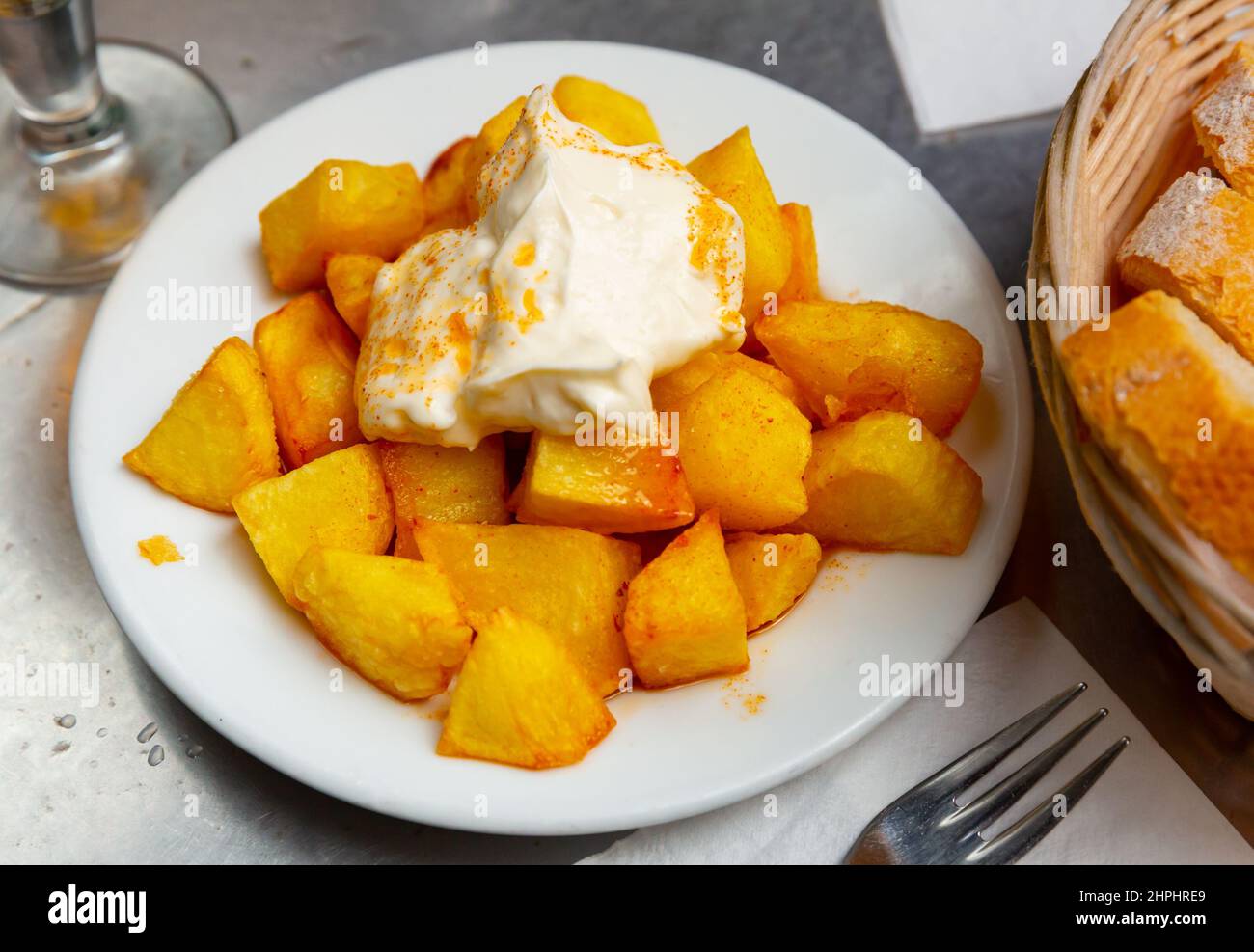 Spanish dish Patatas bravas with hot sauce Stock Photo - Alamy