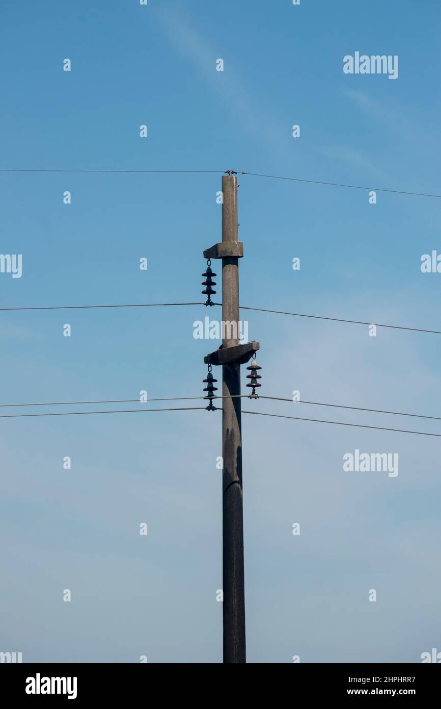 poles for power lines on the side of the road Stock Photo - Alamy