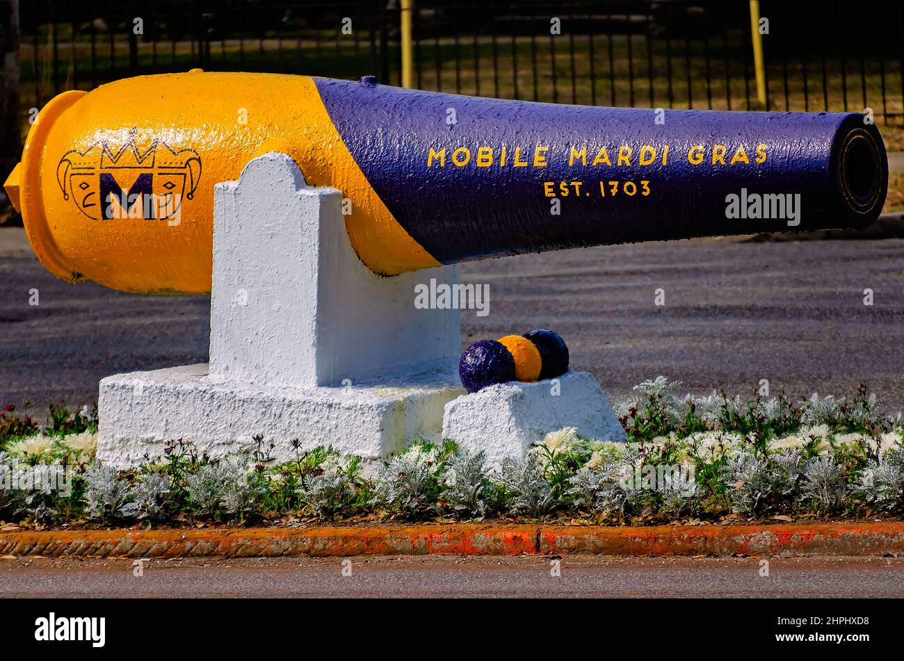 A Civil War cannon is painted for Mardi Gras on Government Street, Feb ...