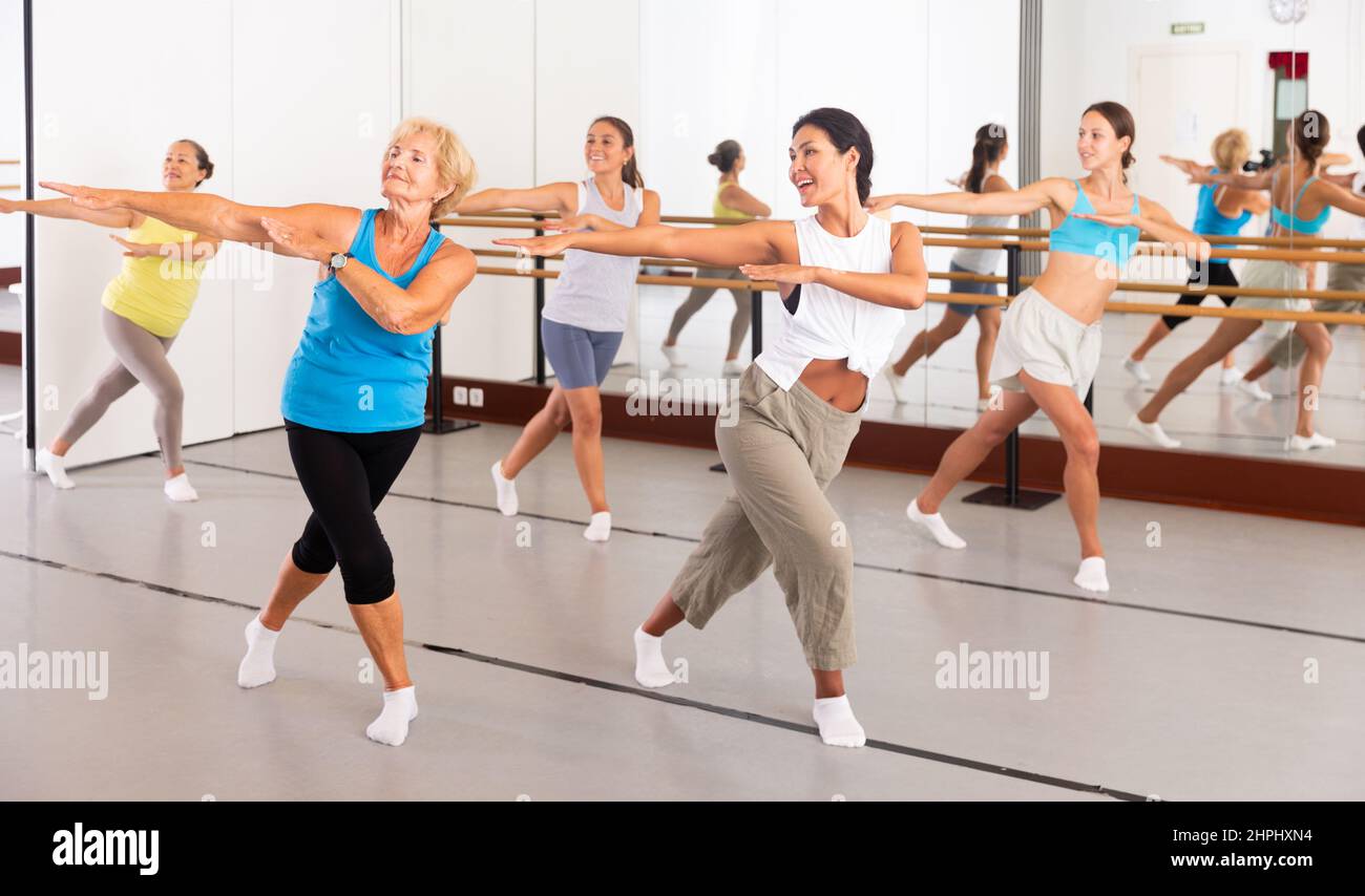 Group of dancers exercising modern dance movements in ball room Stock ...