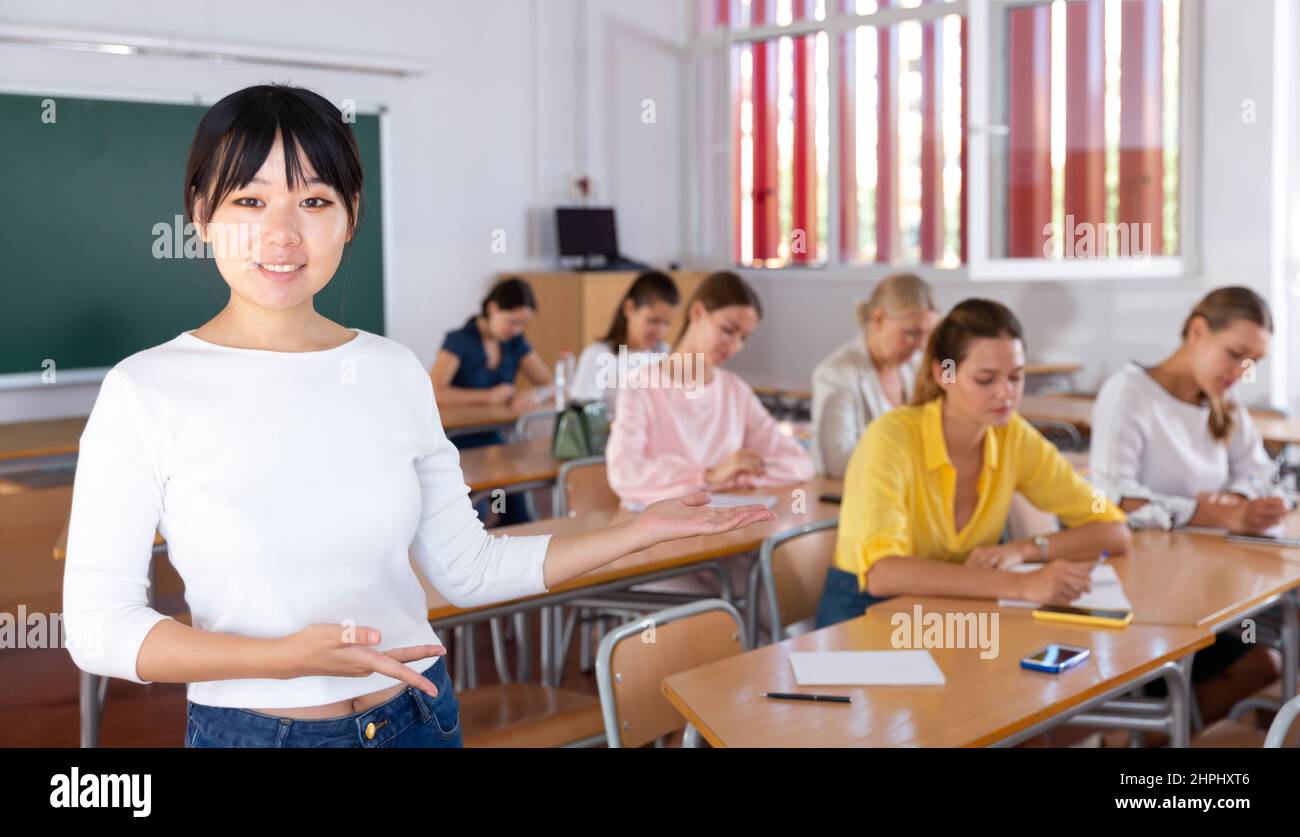 chinese woman student standing in classroom Stock Photo - Alamy