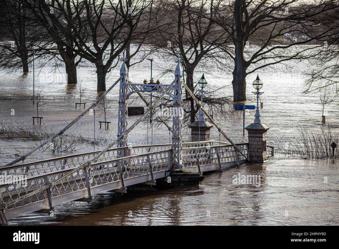 Hereford, UK. 21st Feb, 2022. The Victoria Bridge is seen submerged by ...