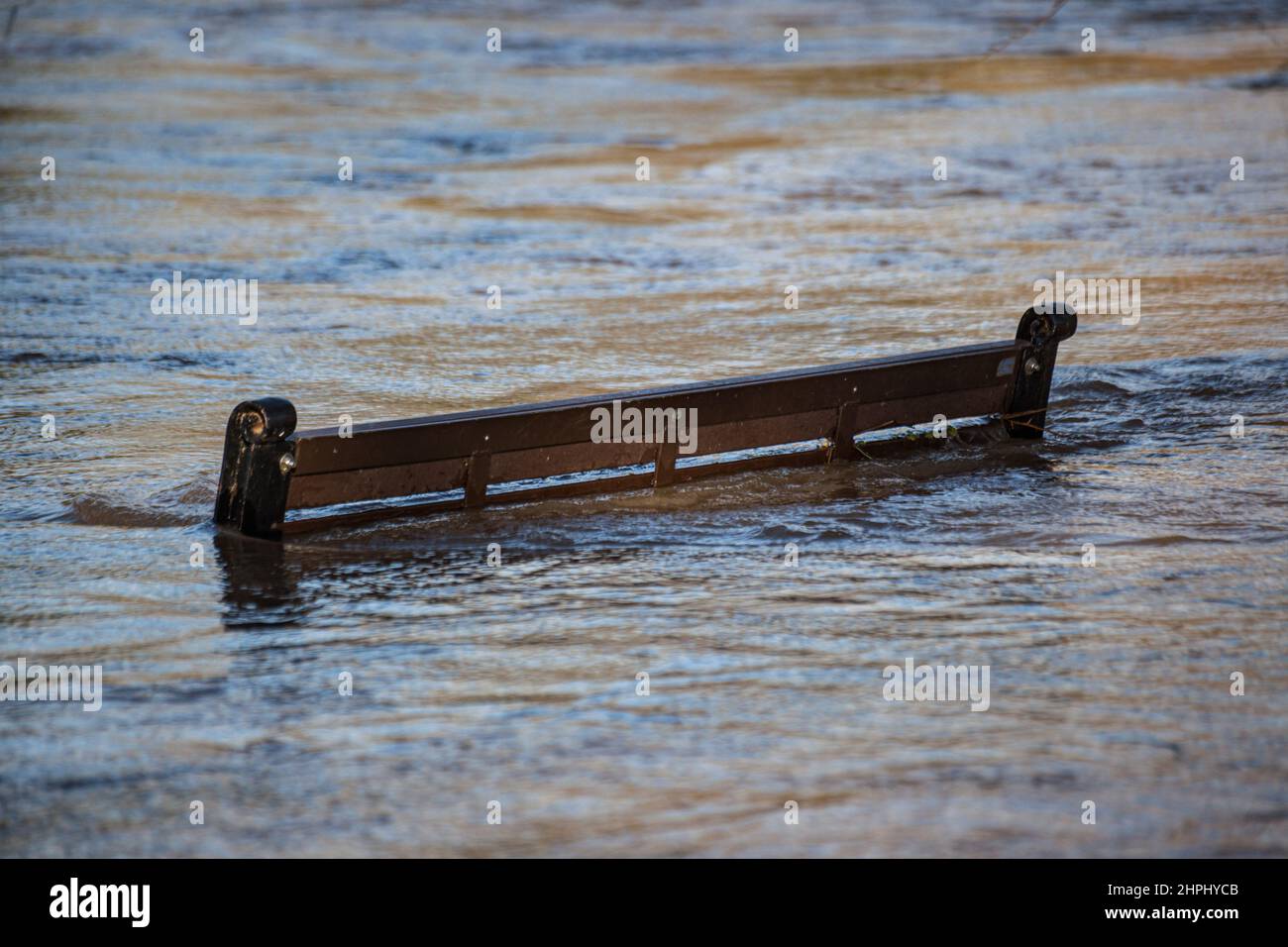 A bench is submerged by the flood water from the River Wye as Storm ...