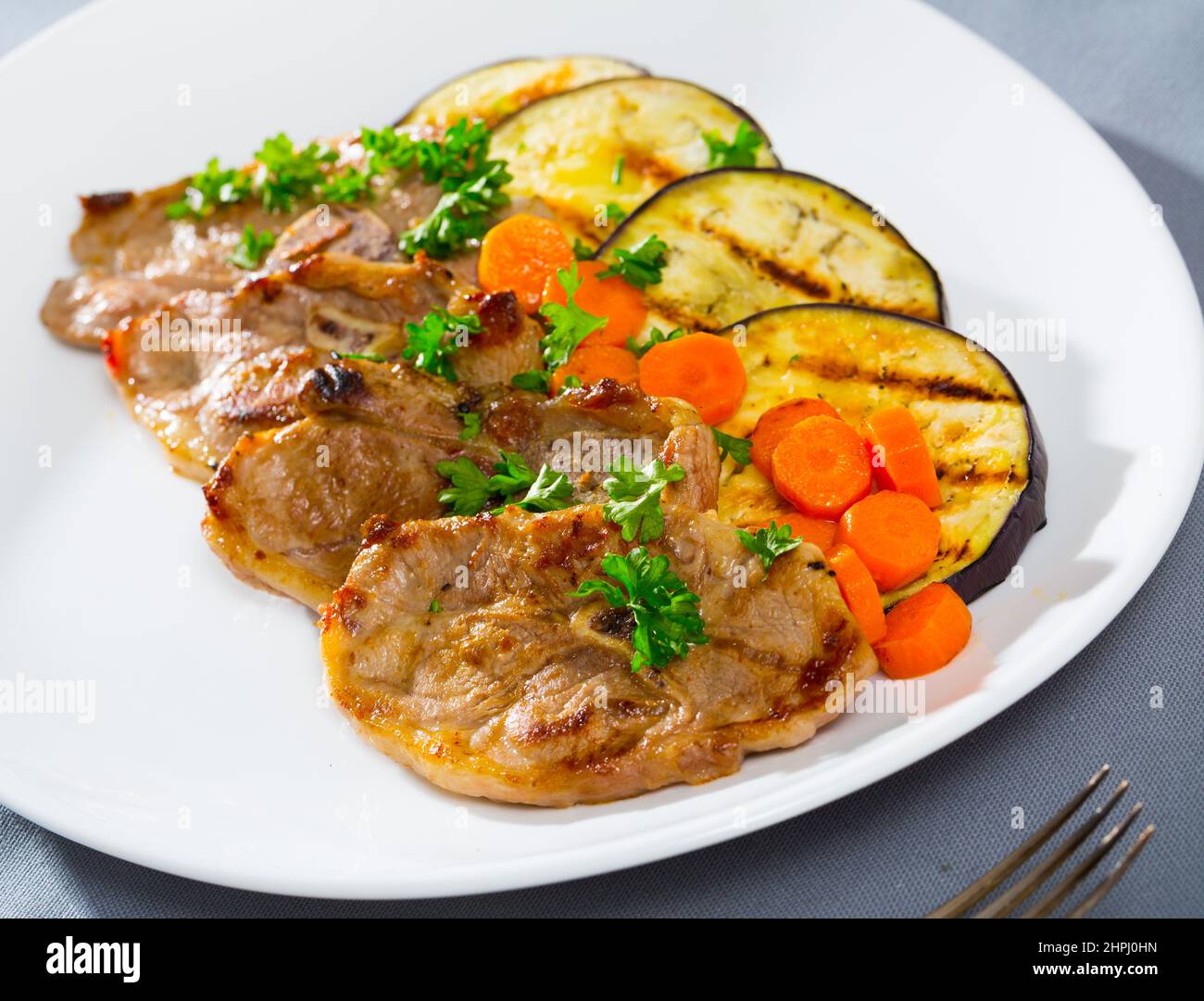 Mutton loin chops grilled with eggplant Stock Photo - Alamy