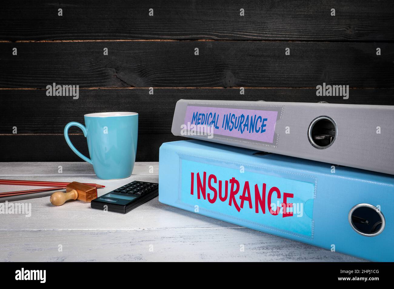 MEDICAL INSURANCE. Document folders on a wooden office desk Stock Photo ...
