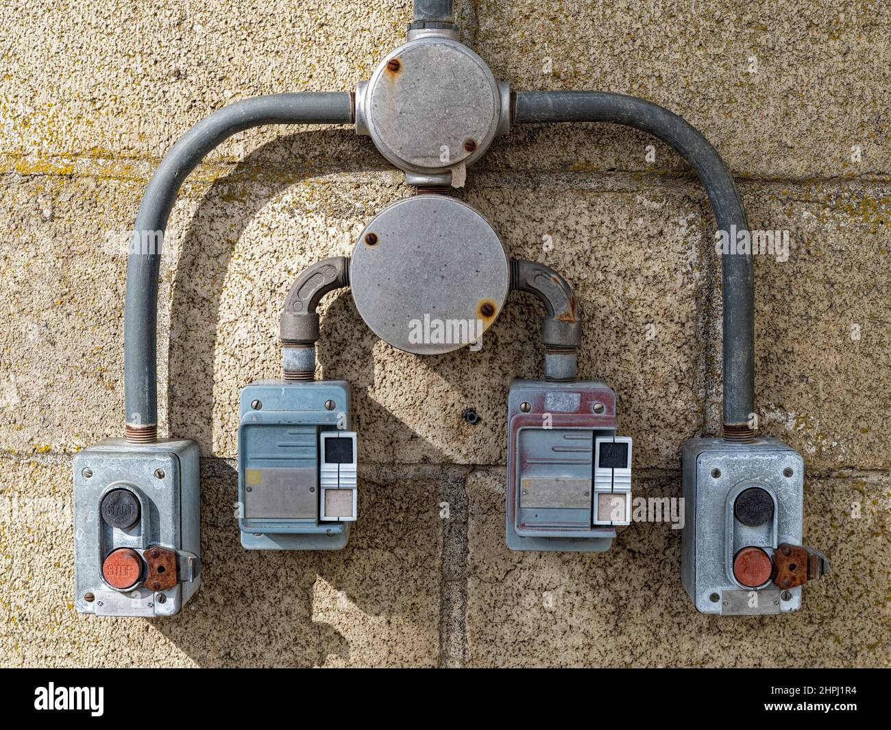 The electrical controls on the exterior of a concrete wall Stock Photo ...
