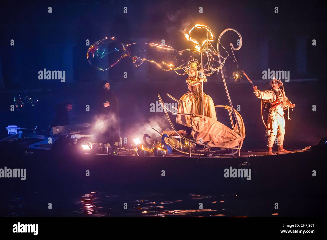 A performer seen making a giant soap bubble during the Venice Carnival ...