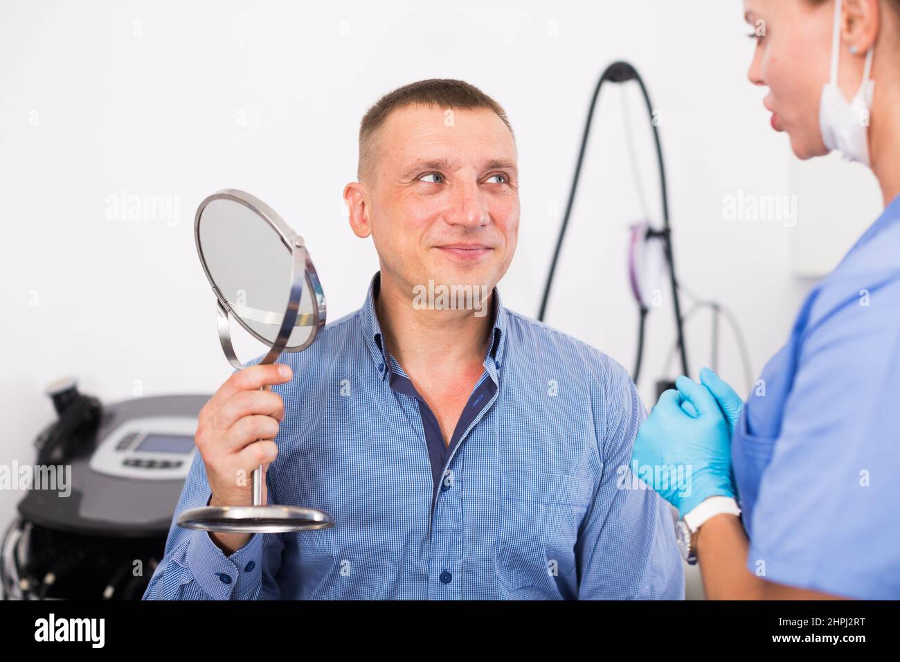Female doctor is preparing client to procedure Stock Photo - Alamy