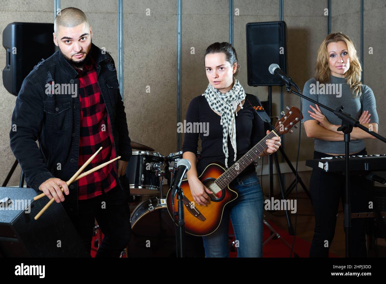 Adult guitarist, drummer and keyboardist Stock Photo - Alamy