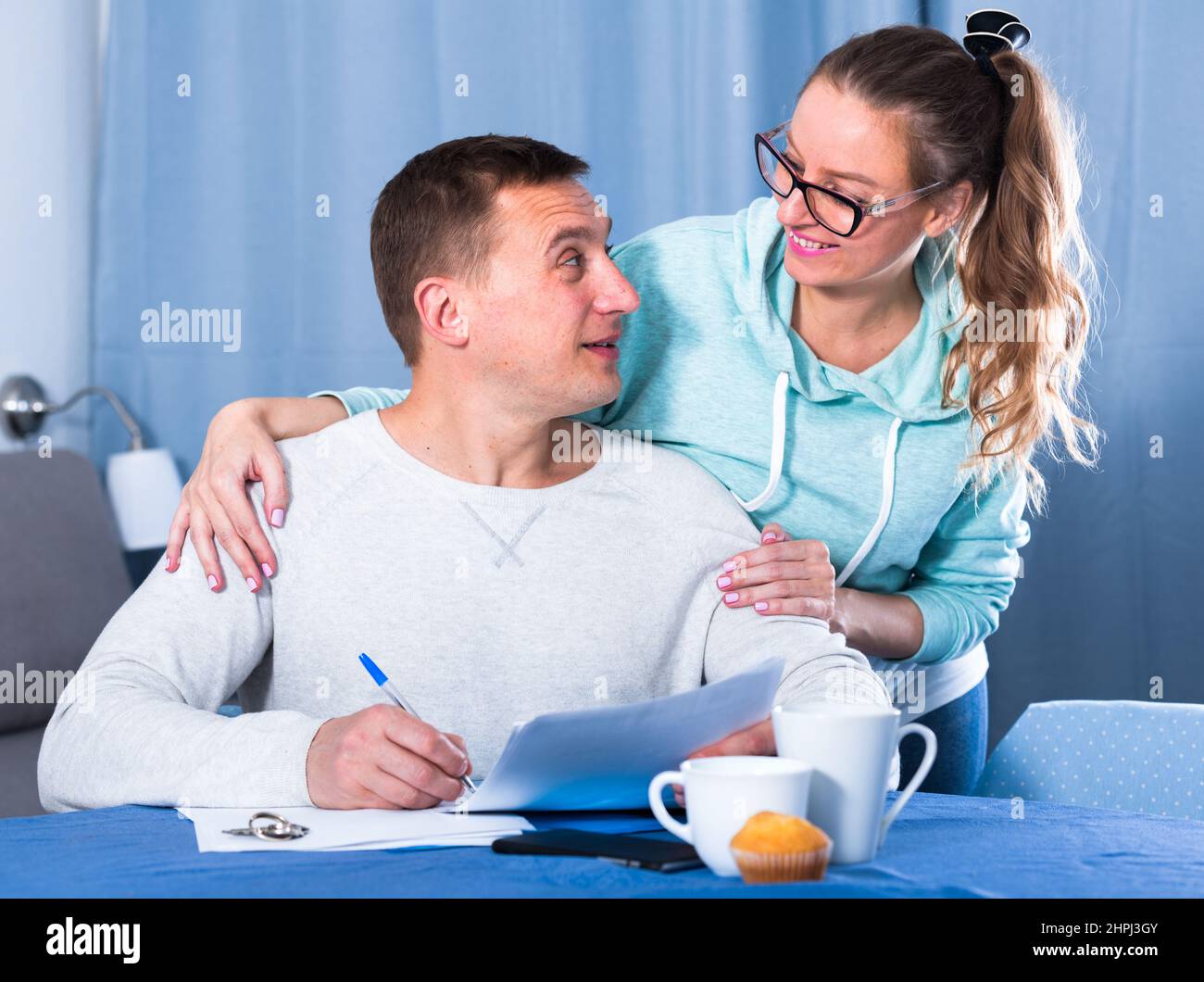 Middle aged people signing papers hi-res stock photography and images ...