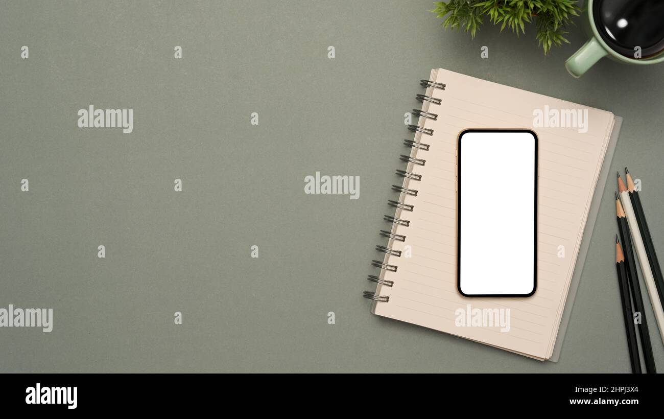 Minimal study table with smartphone white screen mockup, pencils ...