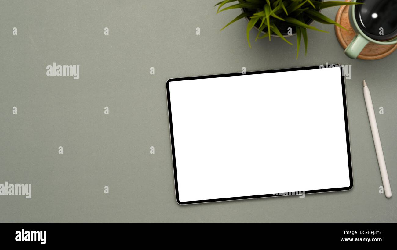 Simple grey workspace background with digital portable tablet white ...
