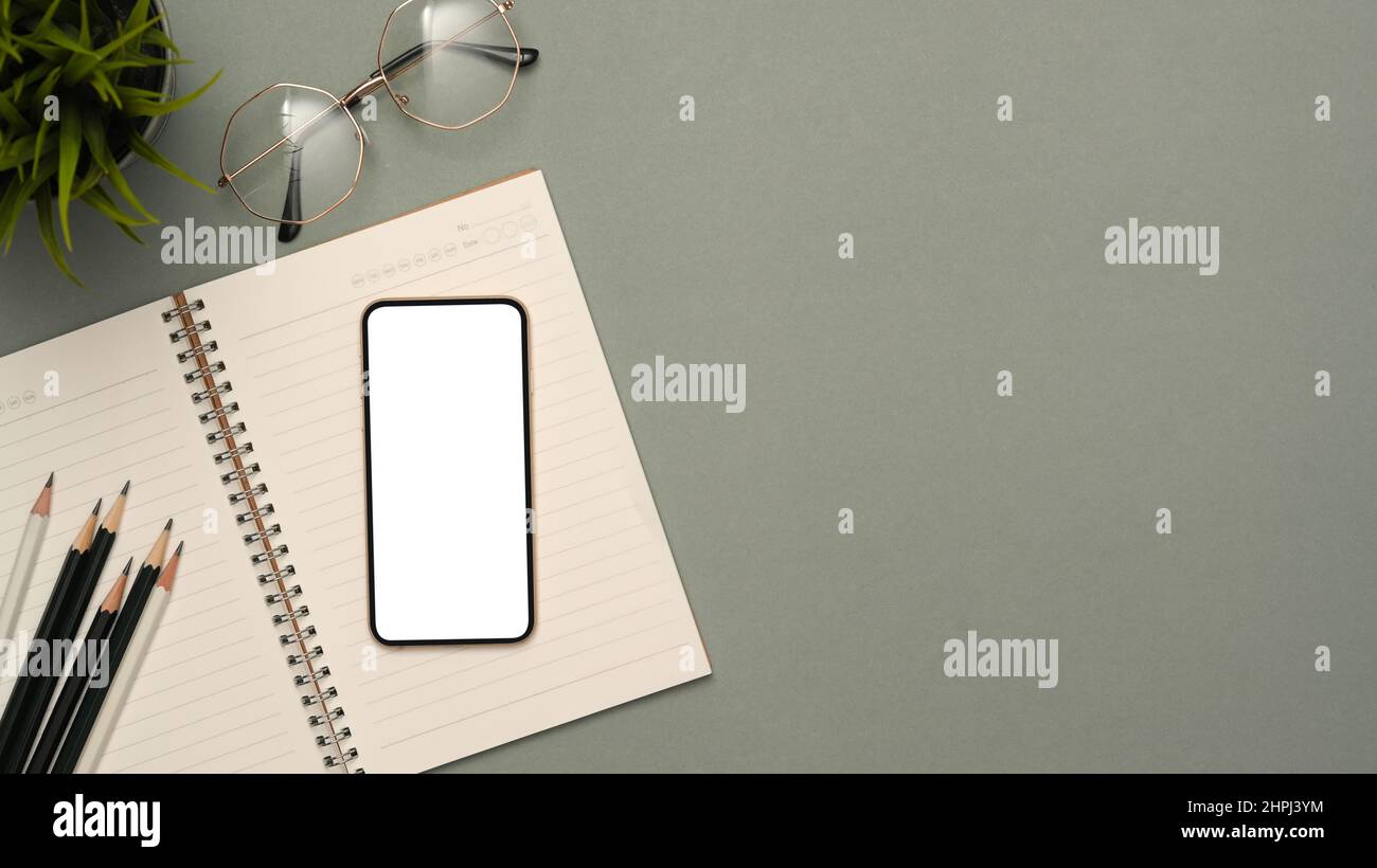 Top view, Study table workspace with stationery, glasses, pencils ...