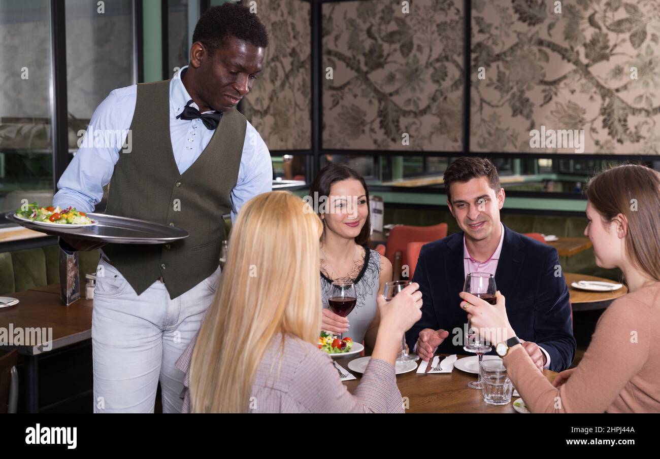 Restaurant waiter work holiday hi-res stock photography and images - Alamy