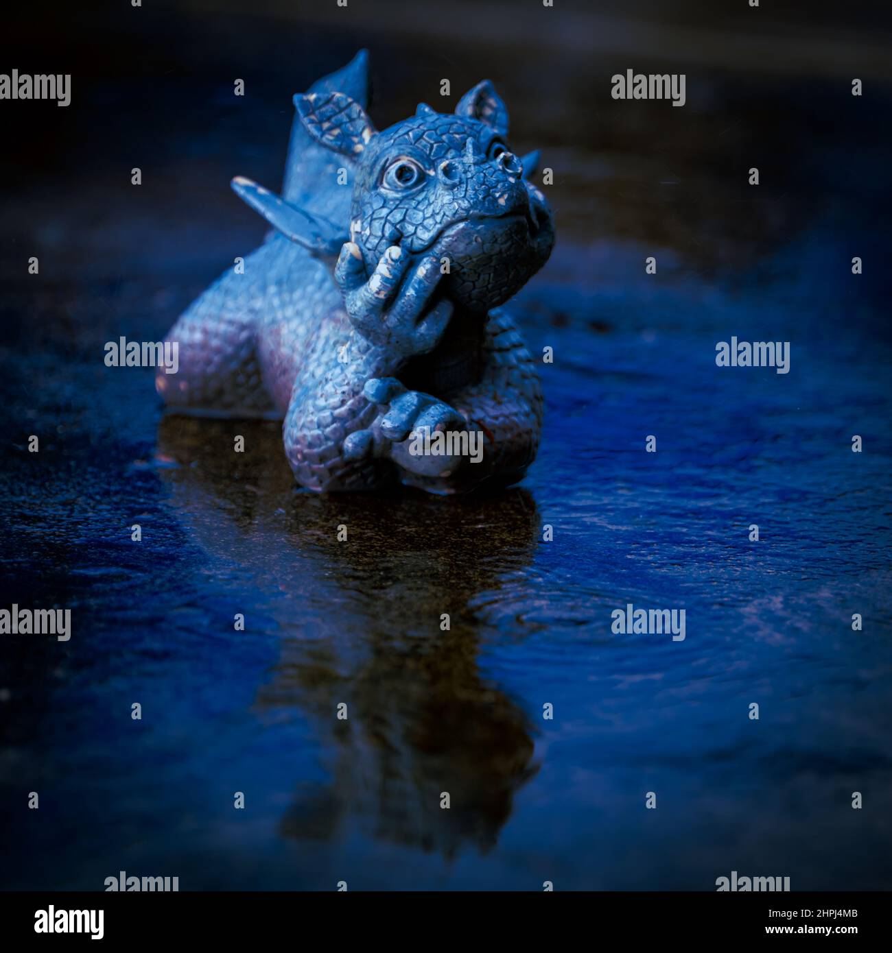 Beautigul view of a Gargoyle creature animal reflecting on the rain ...